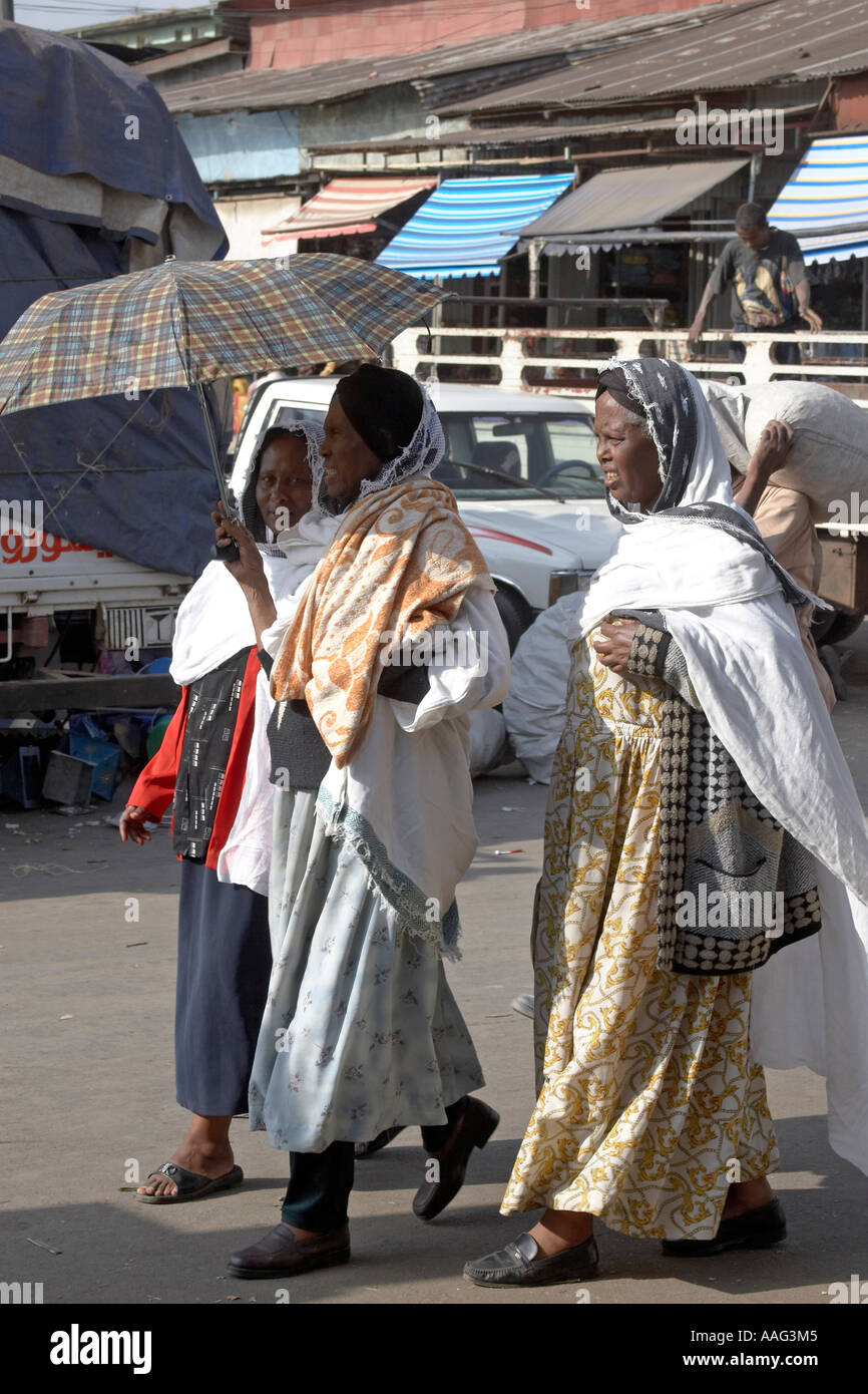 Women with headscarfs and sun umbrella in Addis Ketema Merkato largest ...
