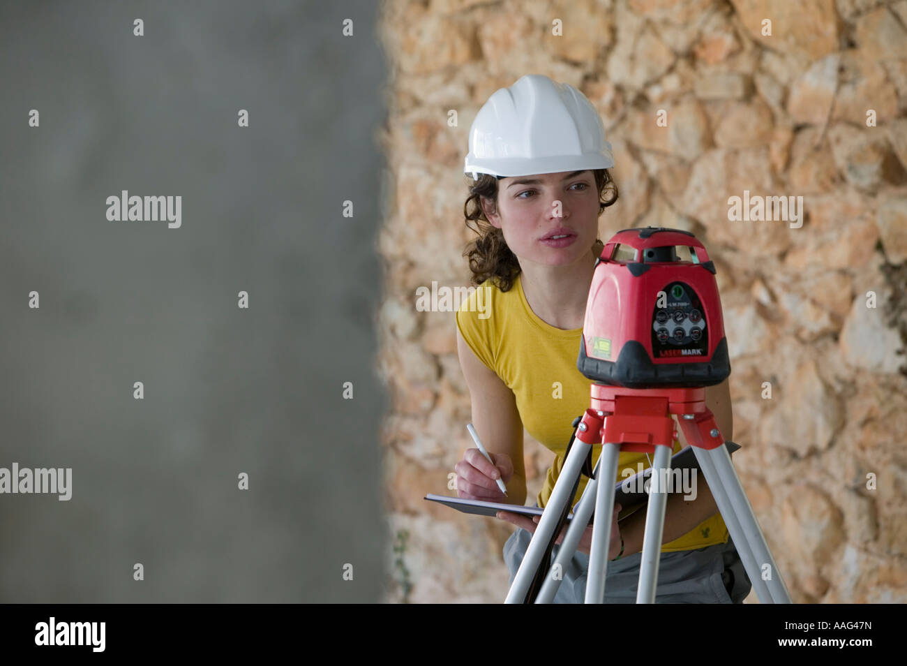 Female civil engineering surveyor with theodolite Stock Photo - Alamy