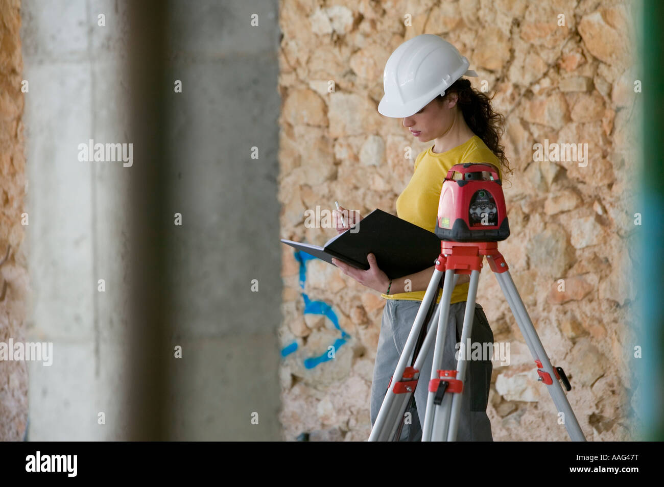 Female civil engineering surveyor with theodolite Stock Photo - Alamy