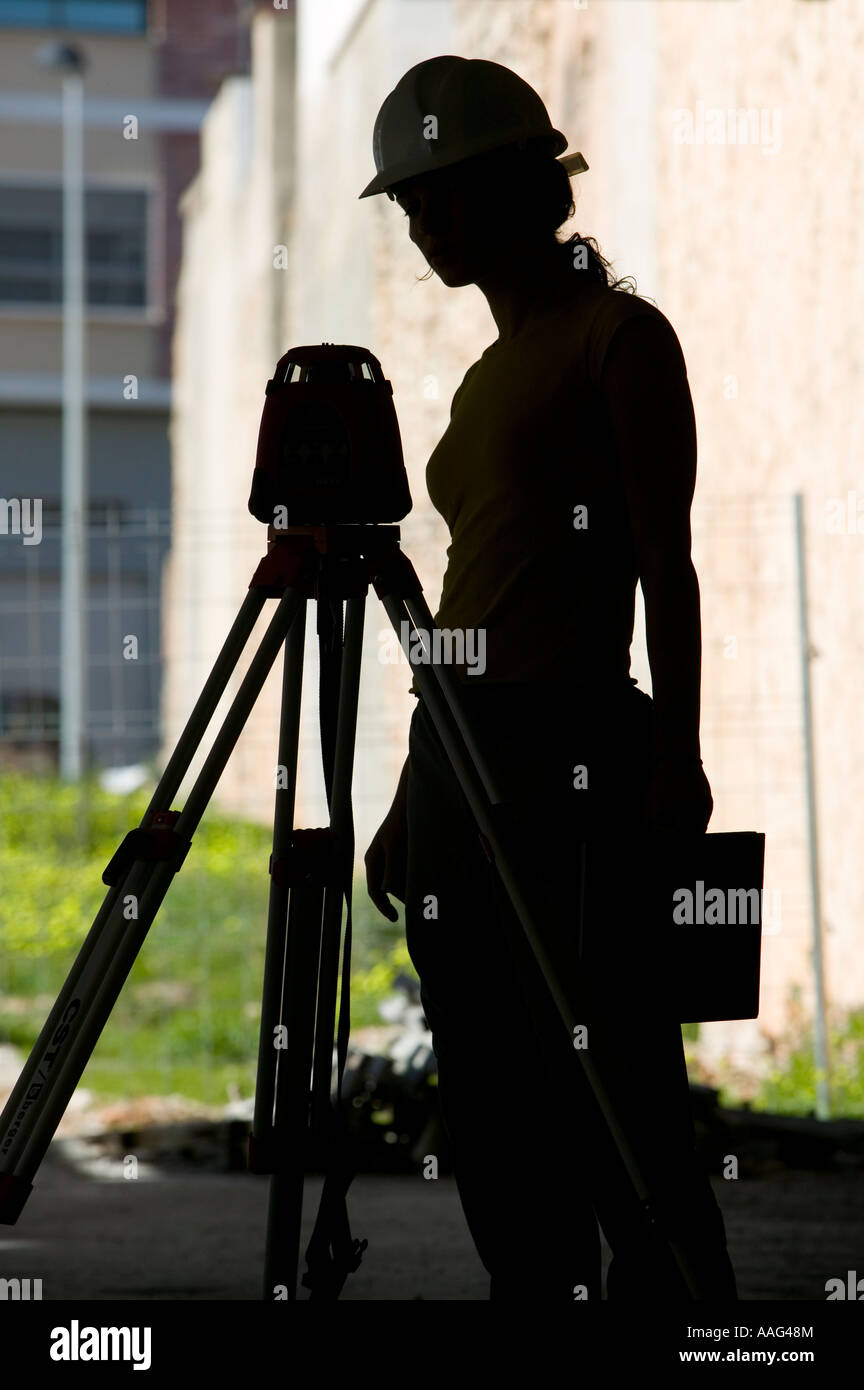 Silhouetted female civil engineering surveyor with theodolite Stock ...