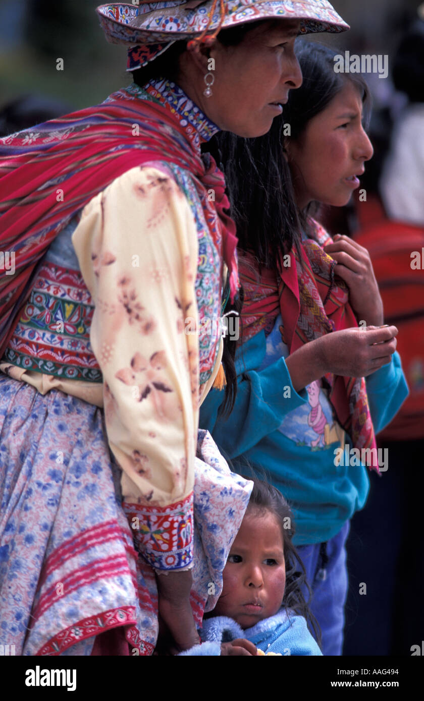 Quechua women in distinctive local dress watching the festival ...