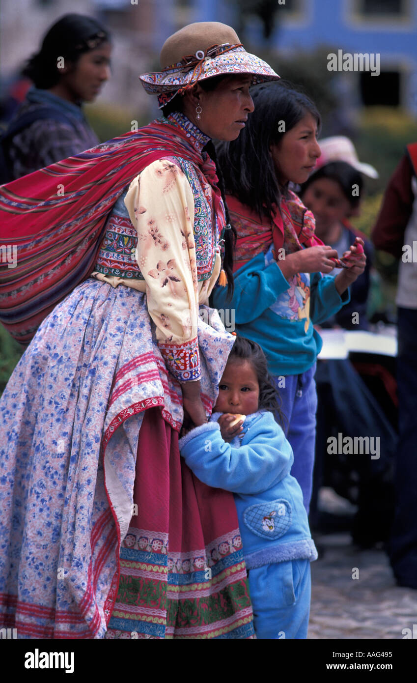 Quechua women in distinctive local dress watching the festival ...