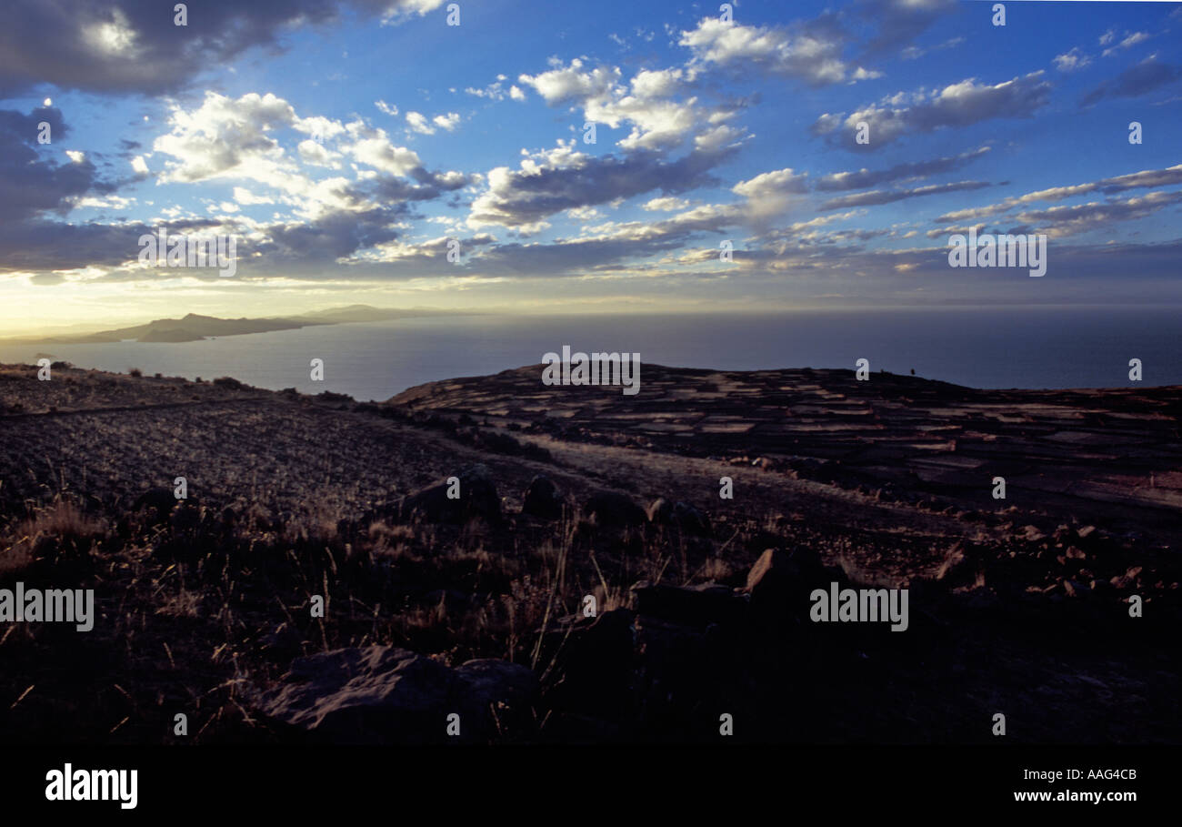 View across Amantani island at sunset Temples of Pachamama Pachatata ...