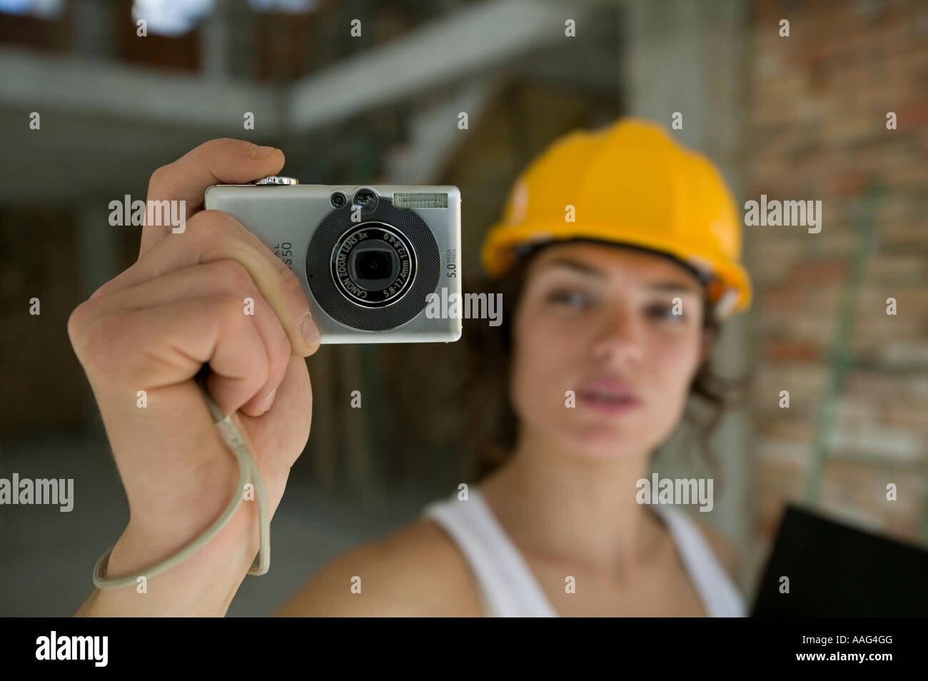 Female civil engineering surveyor using compact digital camera Stock ...
