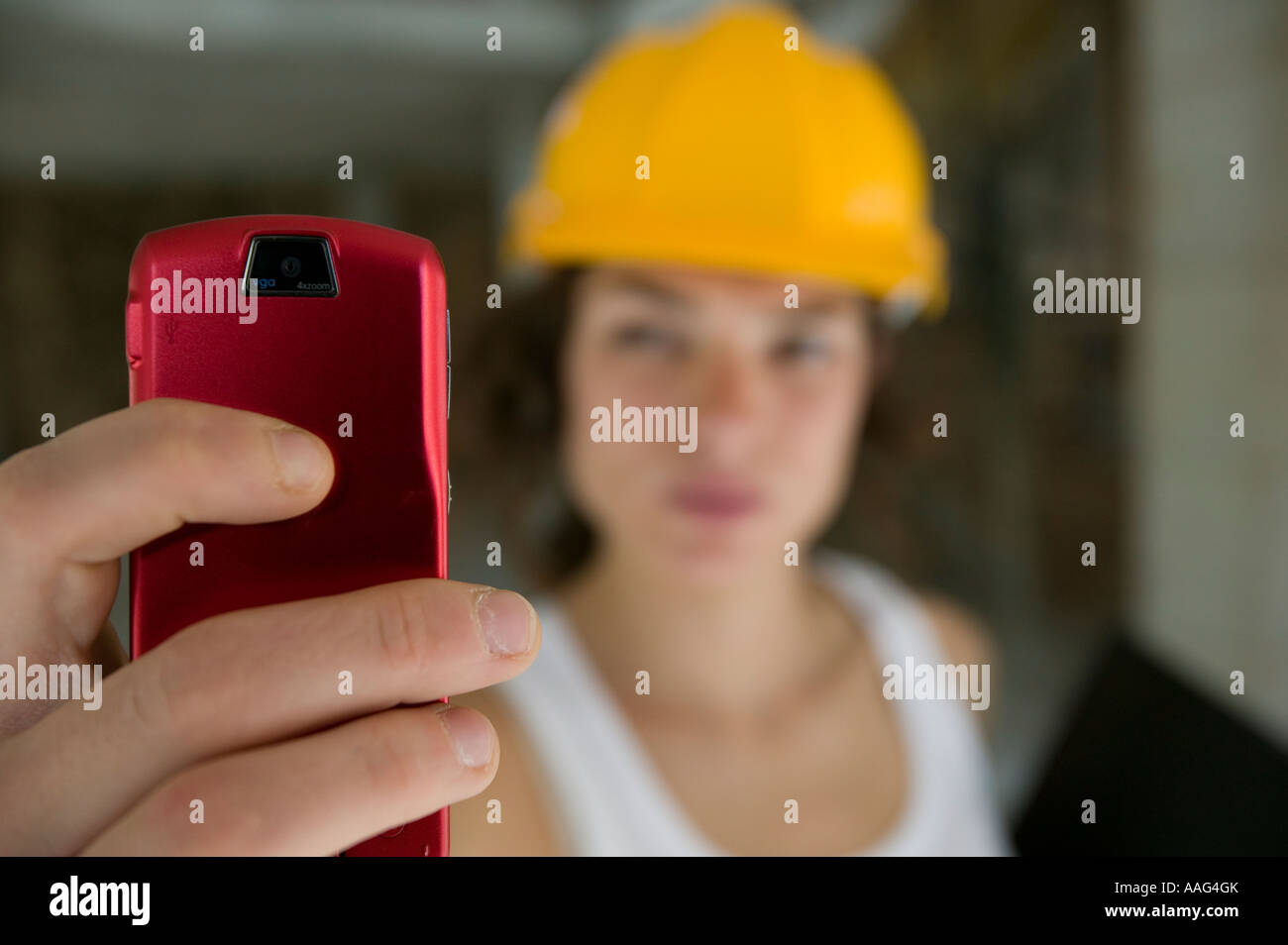 Female civil engineering surveryor using camera phone Stock Photo - Alamy
