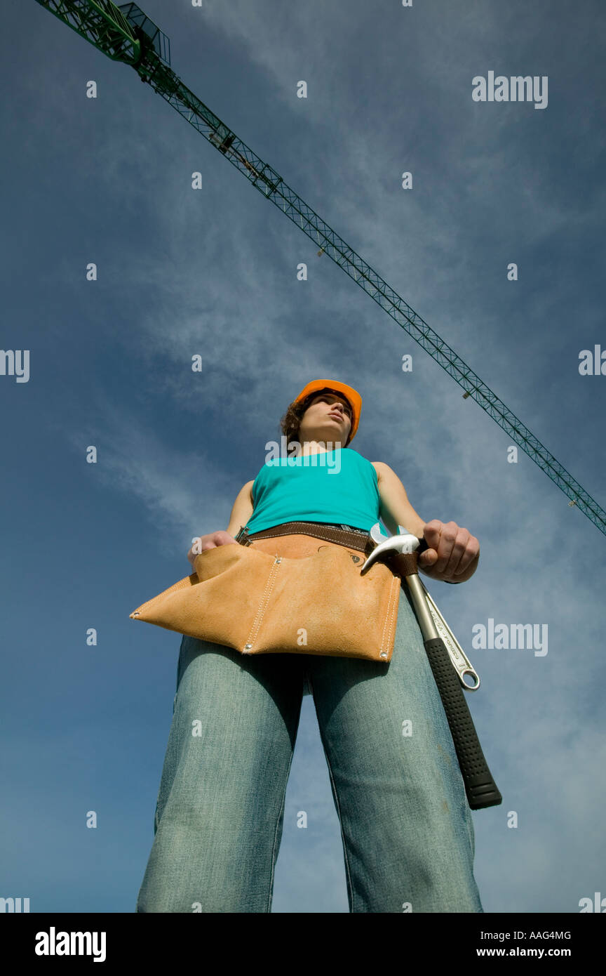 Female construction worker standing on roof of building Stock Photo - Alamy