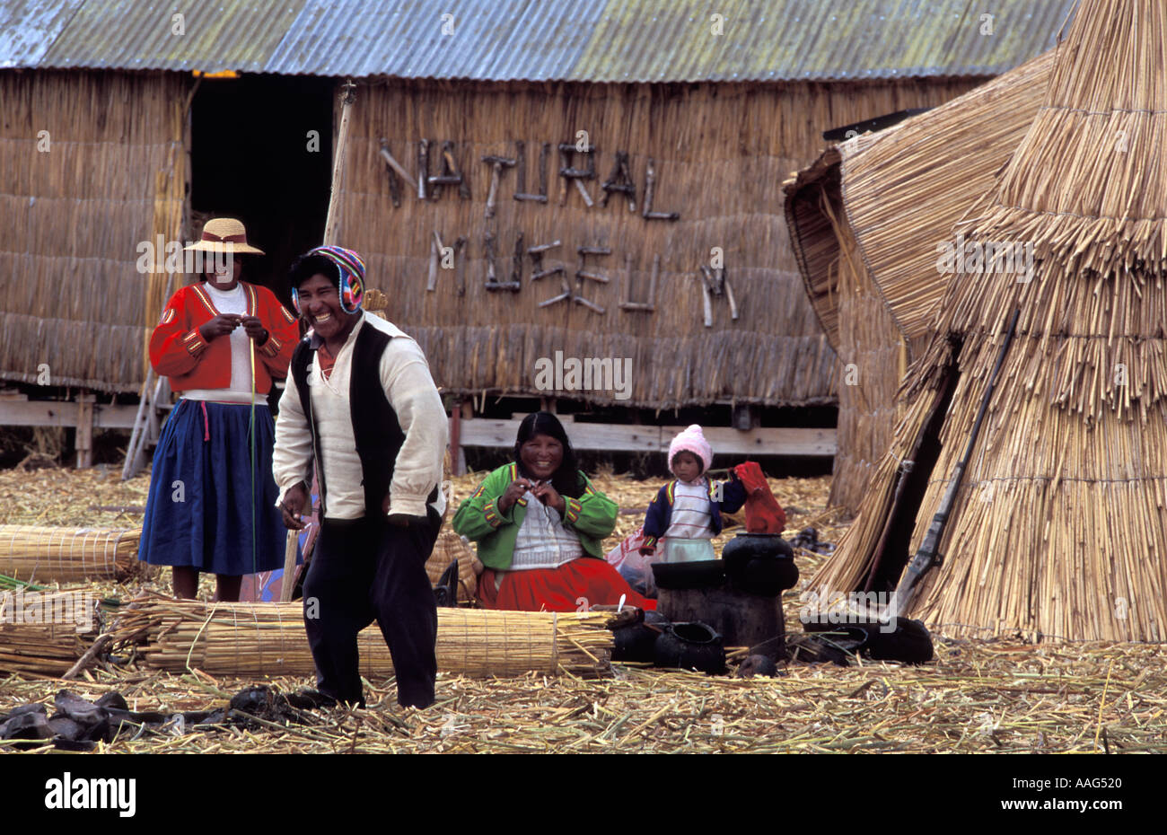 Family of Uros islanders Floating islands near Puno Lake Titicaca Peru ...