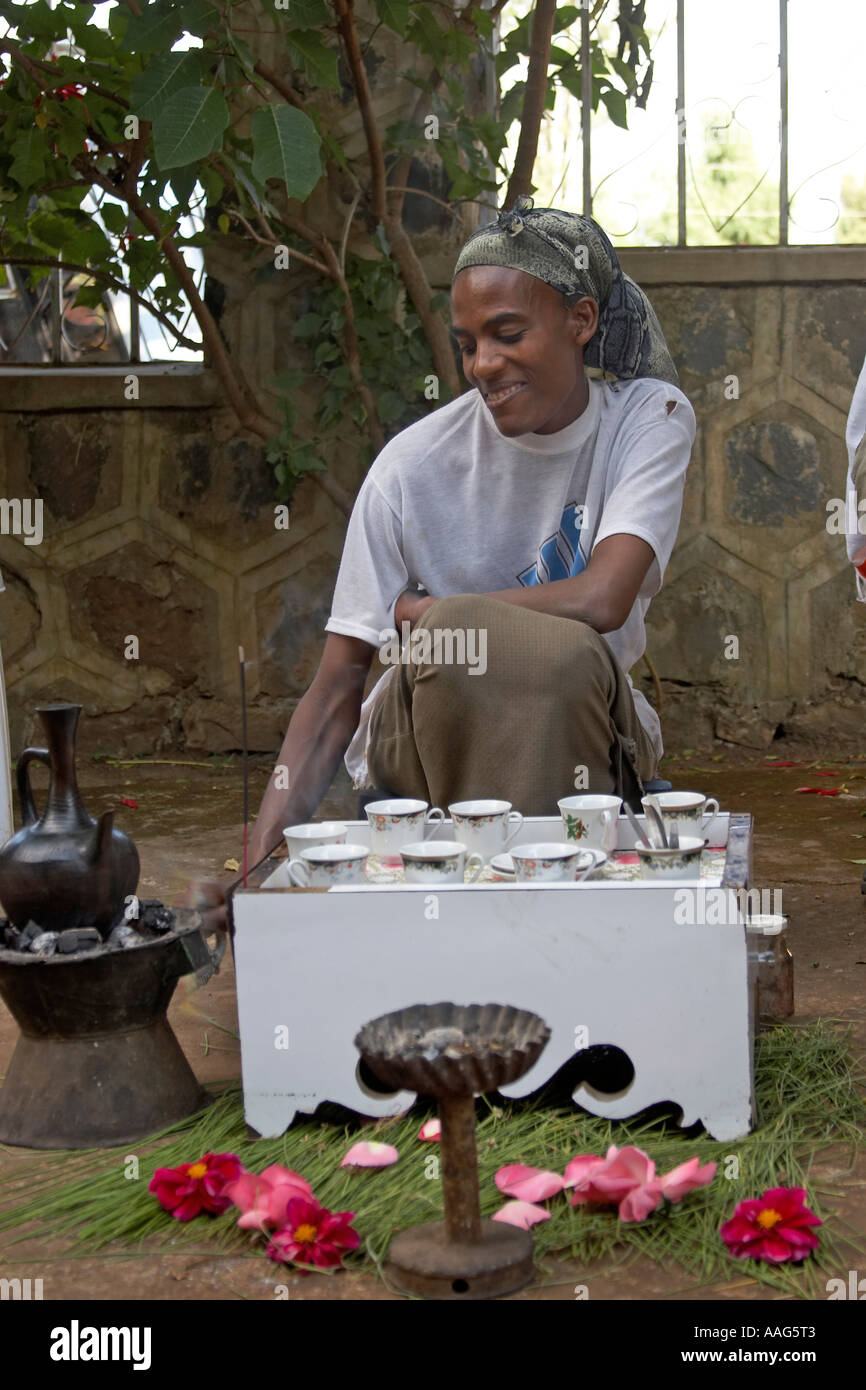 Woman in traditional ceremony making coffee in Bure Ethiopa Africa ...