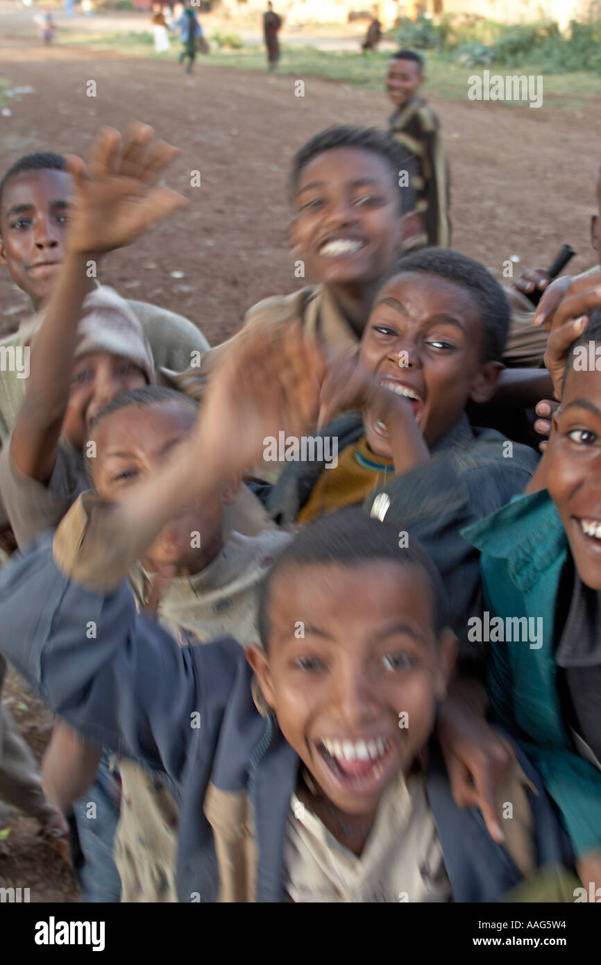 Crowd of smiling african people and children with motion blur in Bure ...