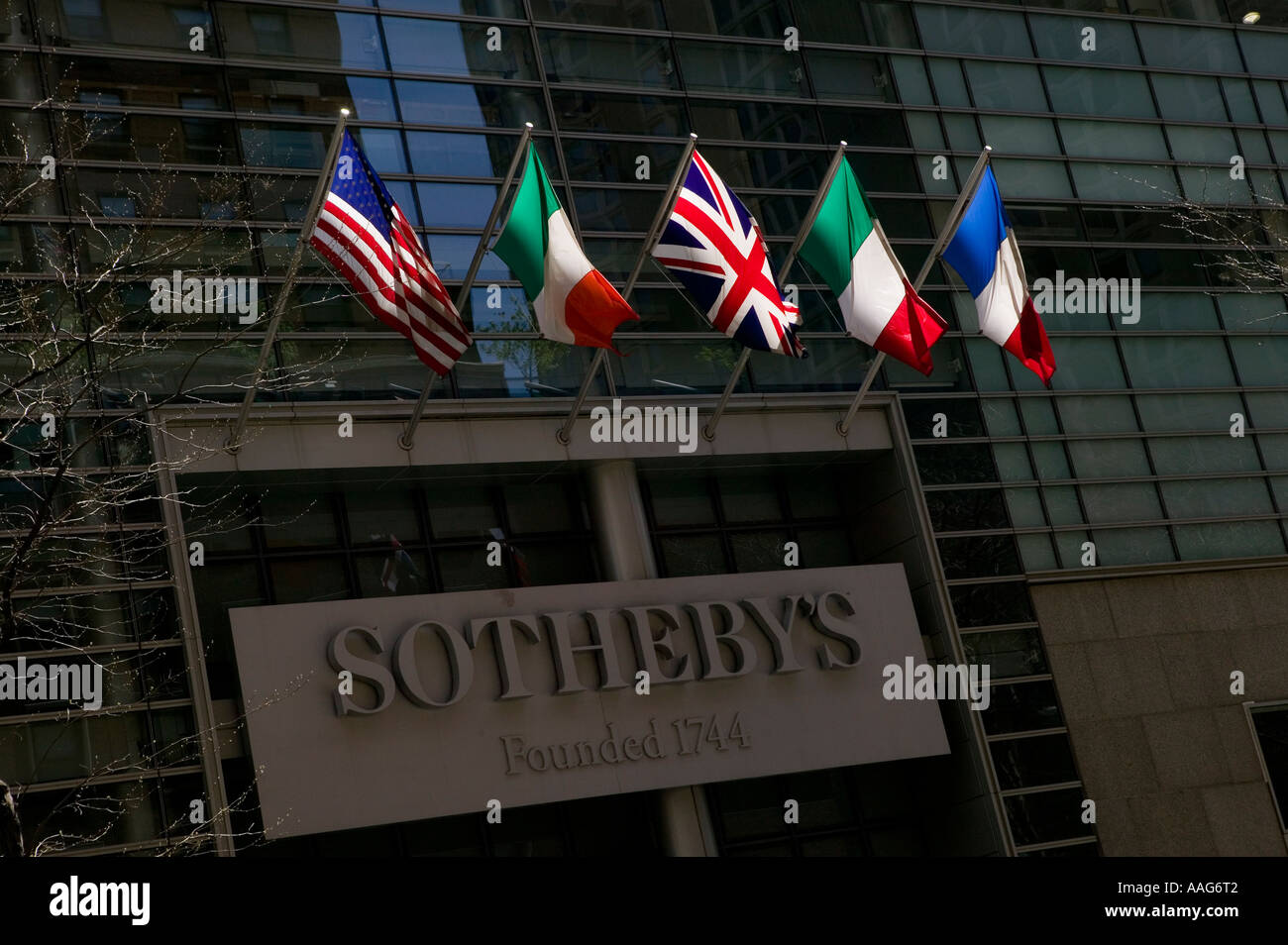 Flags flap in the sun on the facade of Sotheby s on York Avenue in New ...