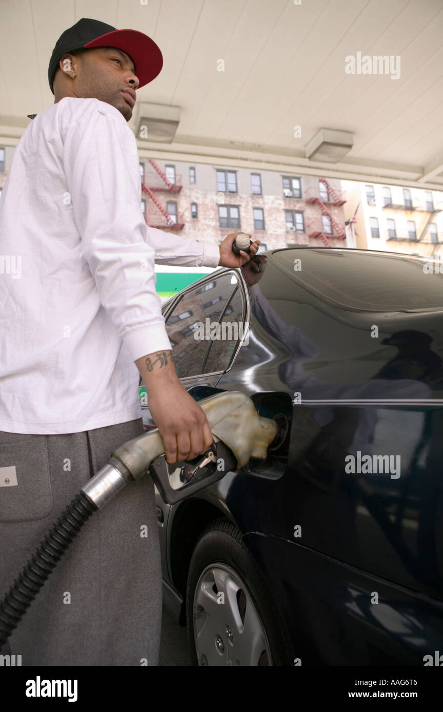 Filling up the car at a gas station in Harlem New York City USA April ...