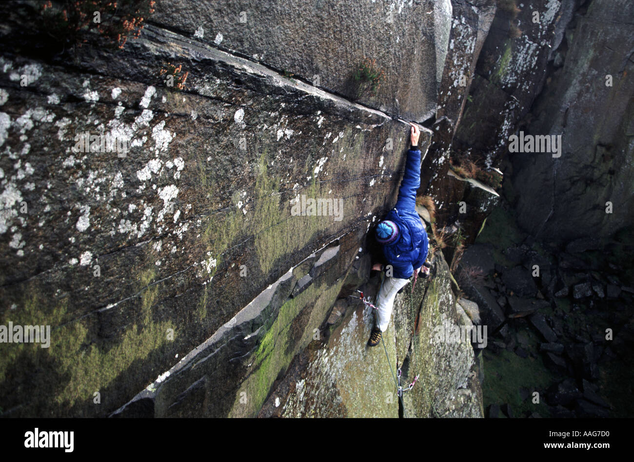 A rock climber in Burbage South quarry in the peak district national ...
