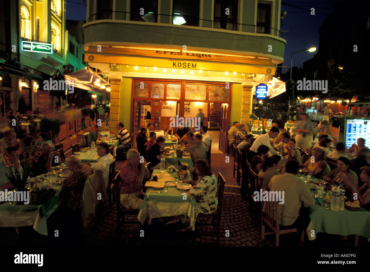 People sitting in the open air area of a fish restaurant Kumkapi in the ...