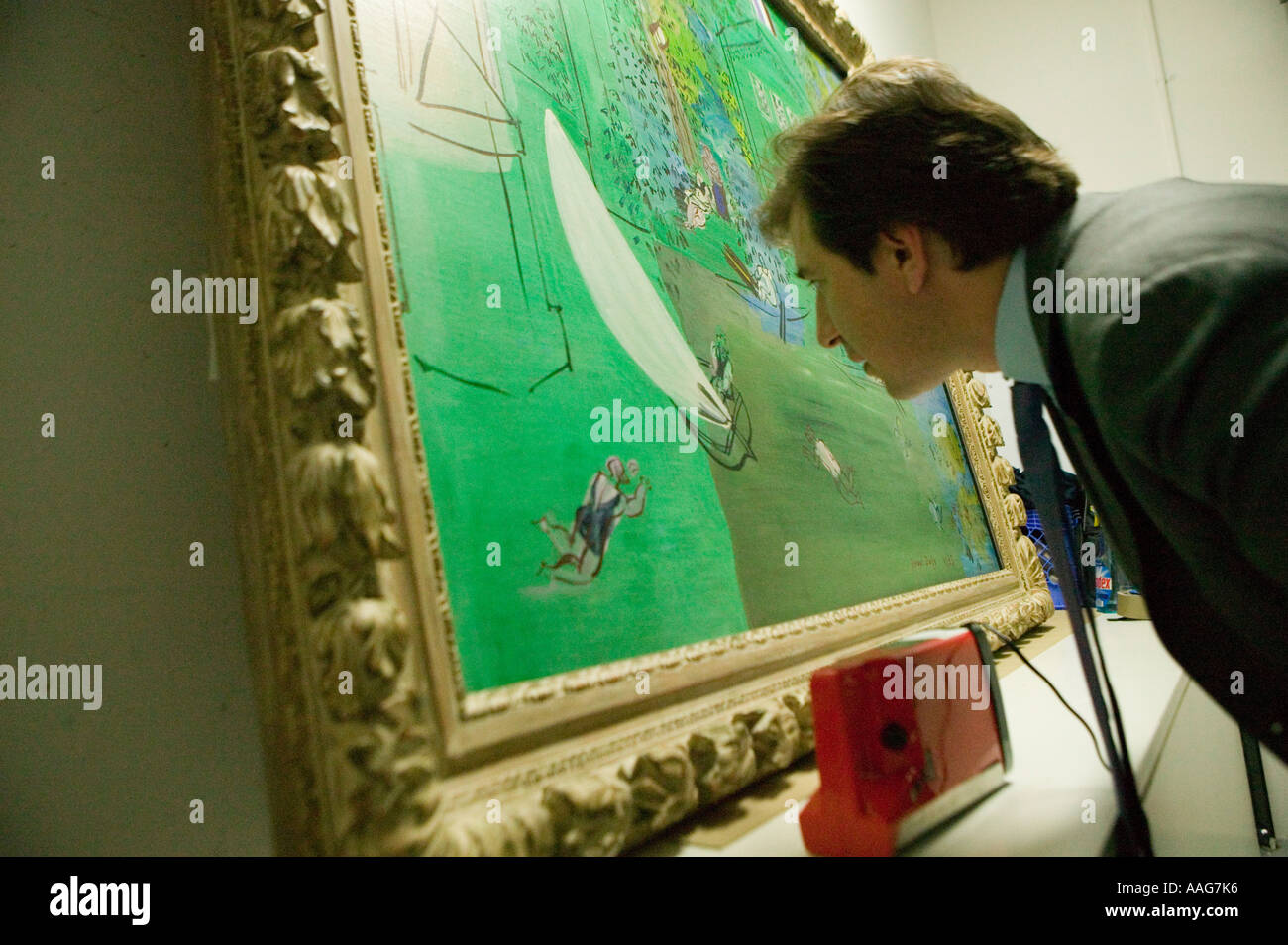 Expert examines Raoul Duffy painting during preview of Impressionism ...