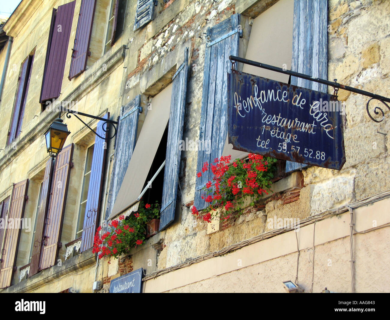 French restaurant sign and blue shutters Stock Photo - Alamy