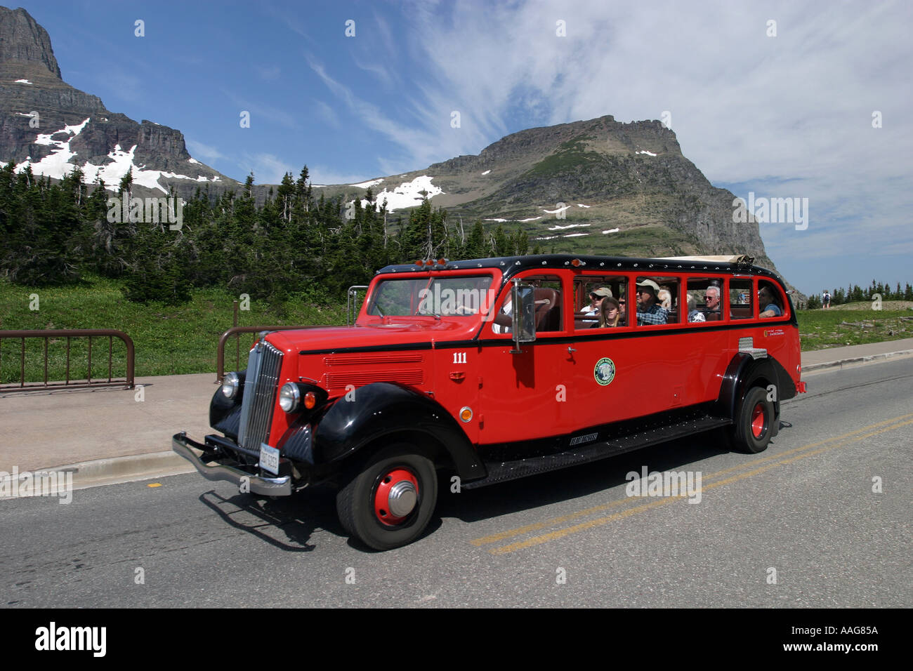 Red jammer bus atop Logan Pass in Glacier National Park Montana Stock ...