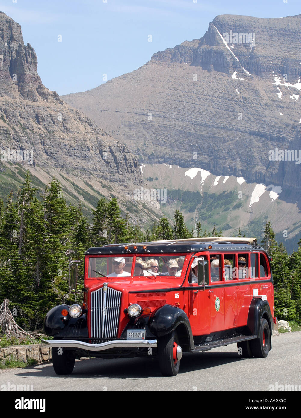Red jammer bus atop Logan Pass in Glacier National Park Montana Stock ...