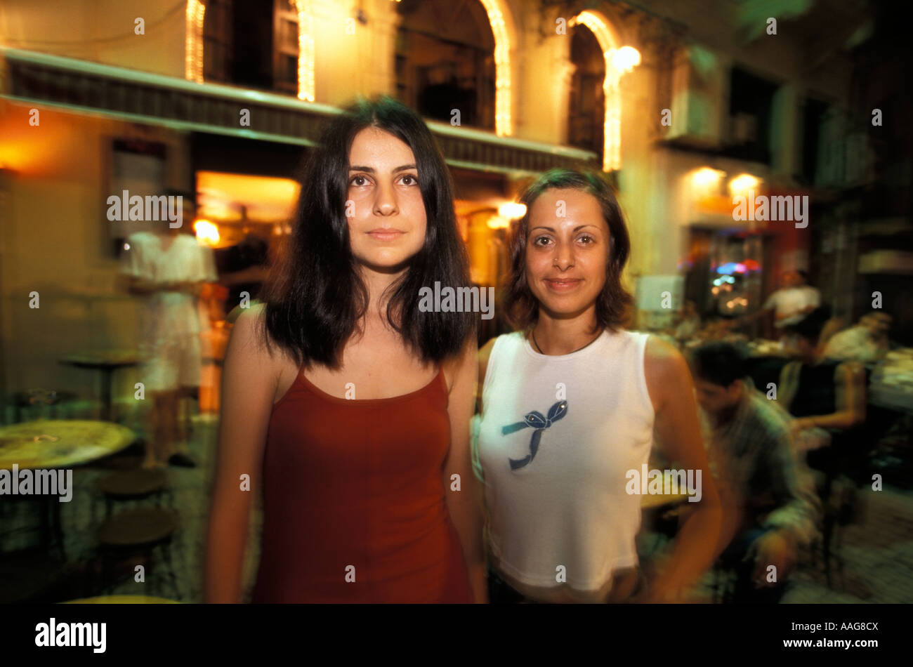 Portrait of tow young women in front of a bar Beyoglu Istanbul Istanbul ...