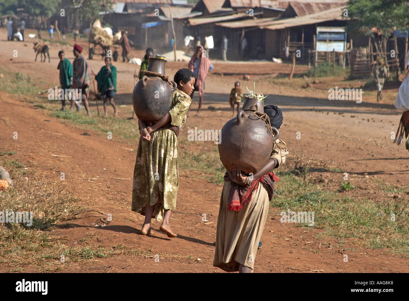 Women working carrying water in pottery jars or urns in Kuch Ethiopia ...
