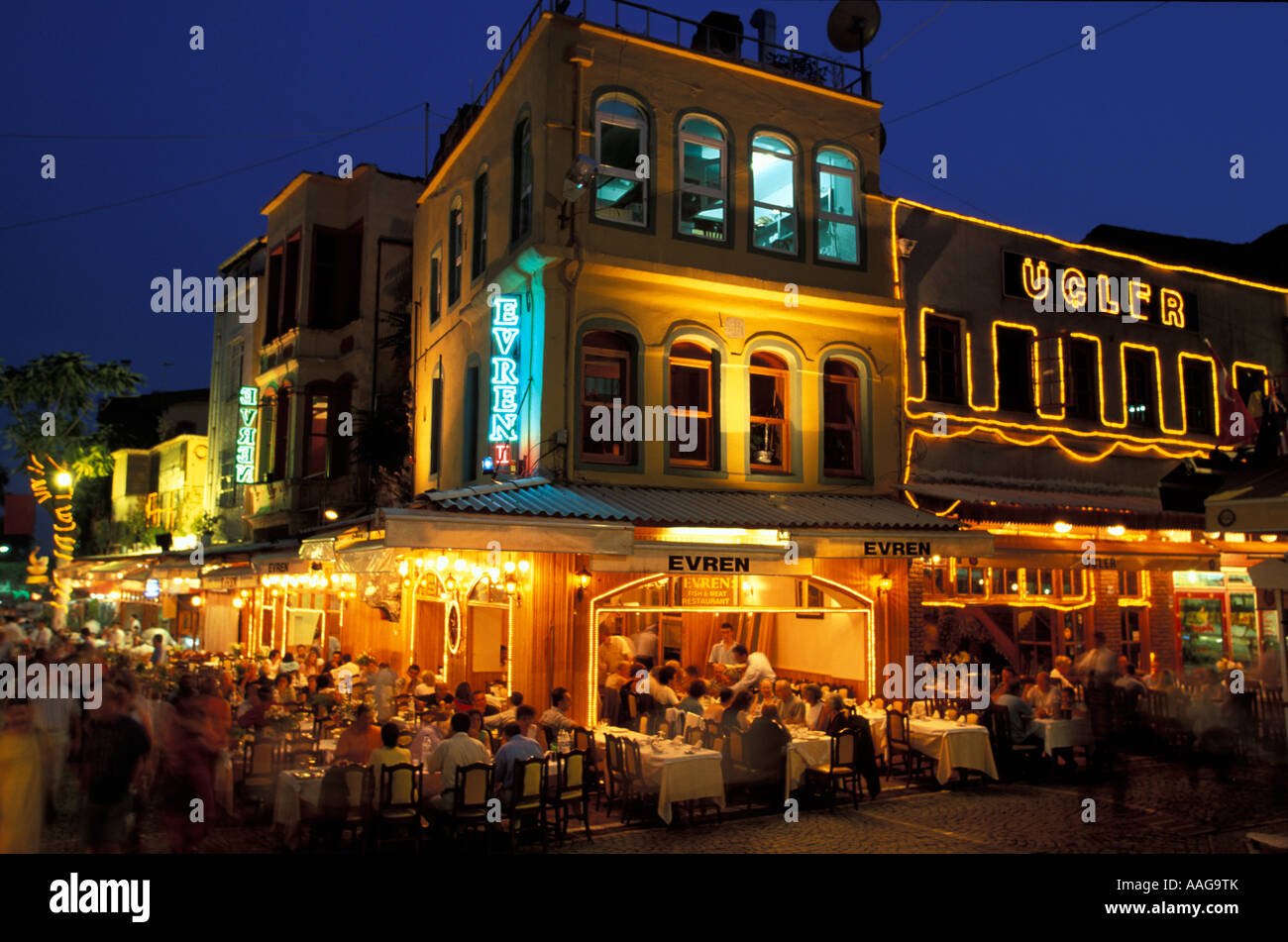 People sitting in the open air area of the fish restaurant Kumkapi in ...