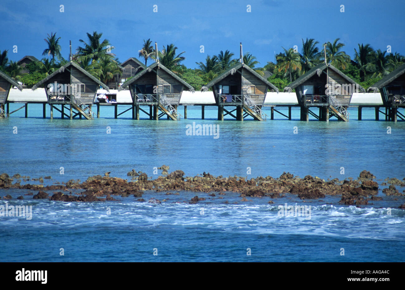 Bungalows on stilts over water bungalows Ari Beach Resort ...
