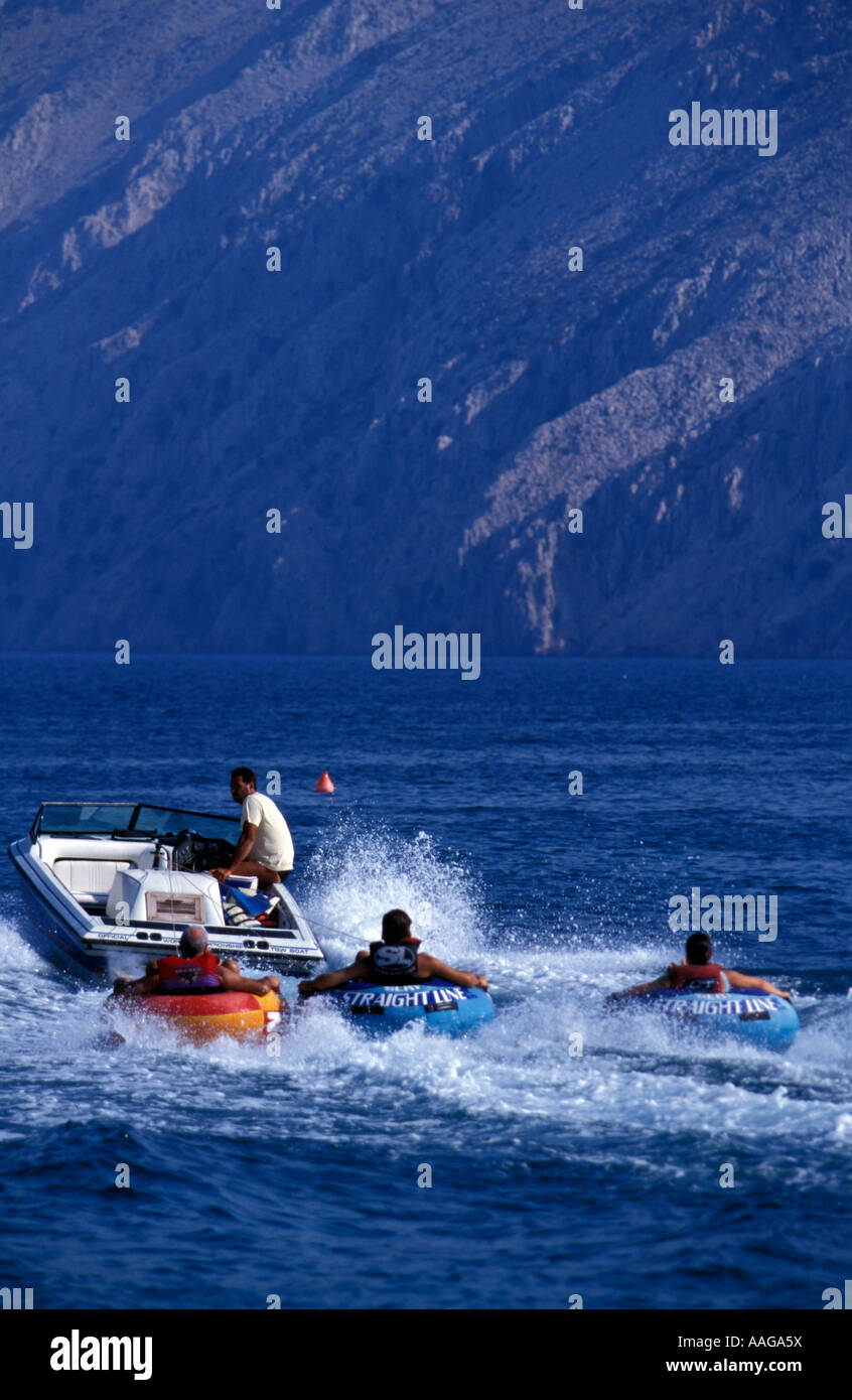 People enjoying Tube Ride Paradise beach Lopar Rab island bay of ...