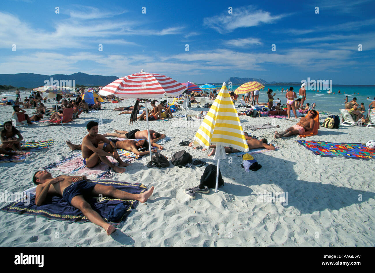 People sunbathing at beach La Cinta San Teodoro Baronia Sardinia Italy ...