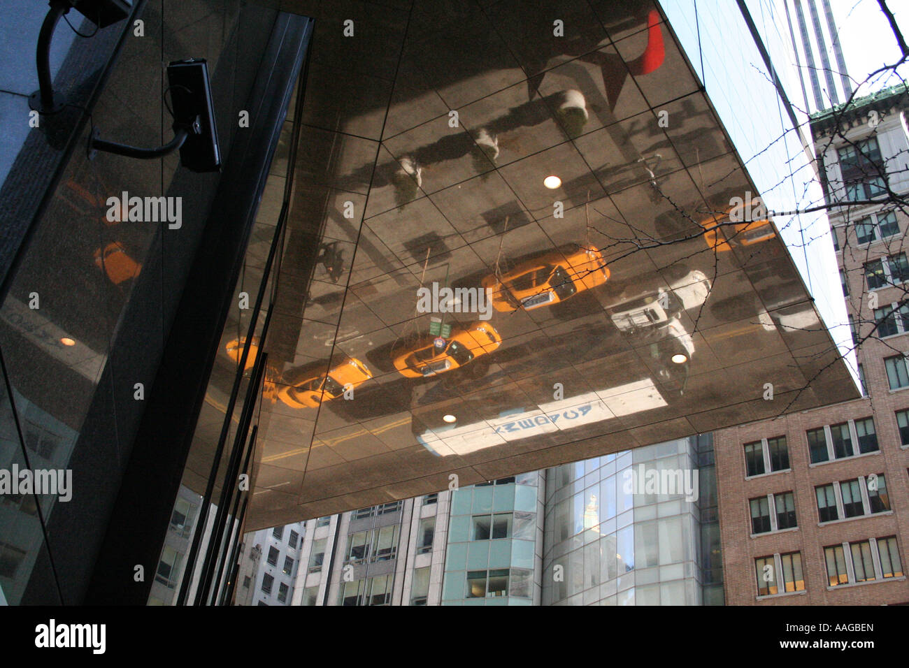 New York taxi cabs reflected in building Stock Photo - Alamy