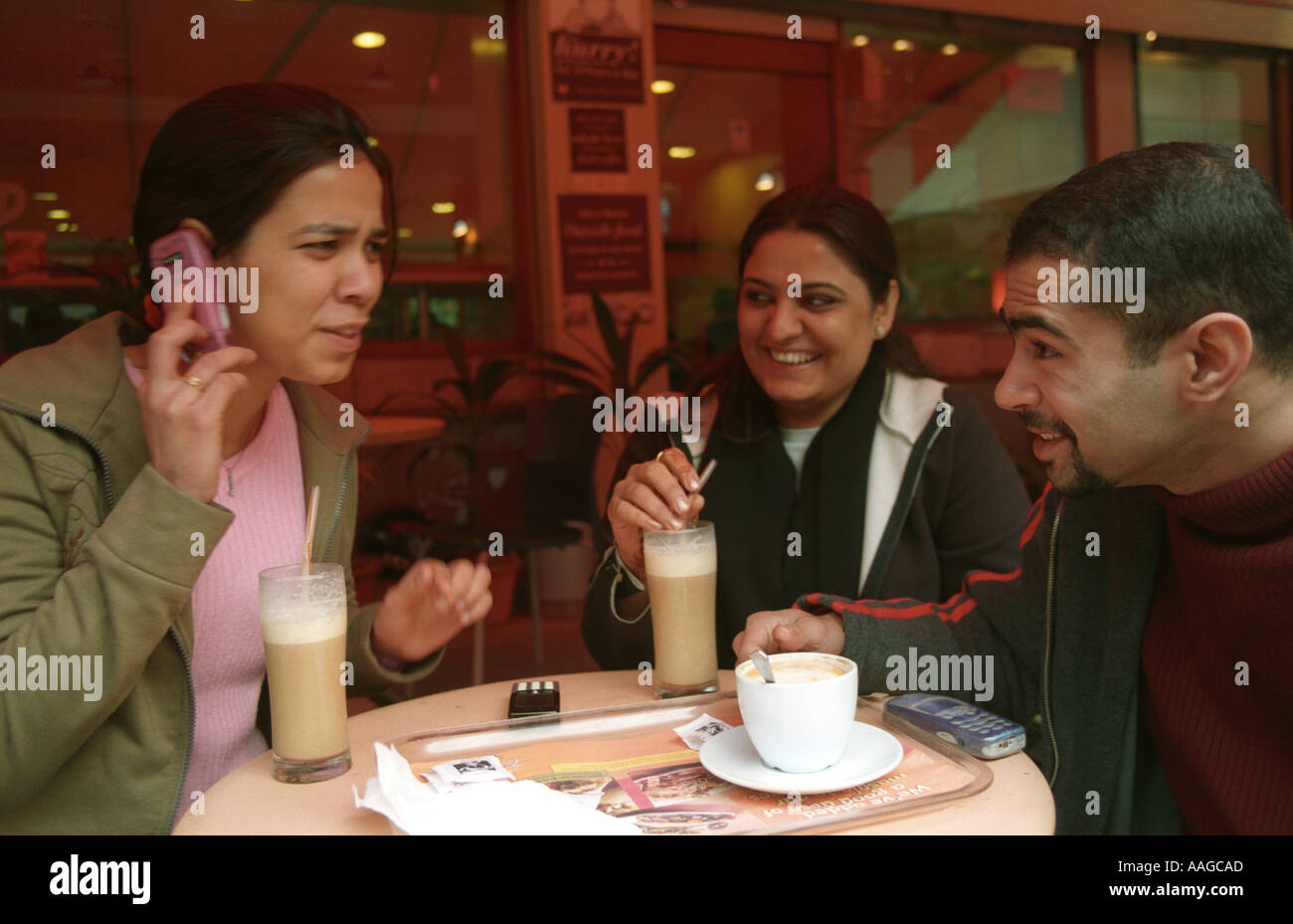 Young people sharing a light moment at Barista Saket Delhi India Stock ...