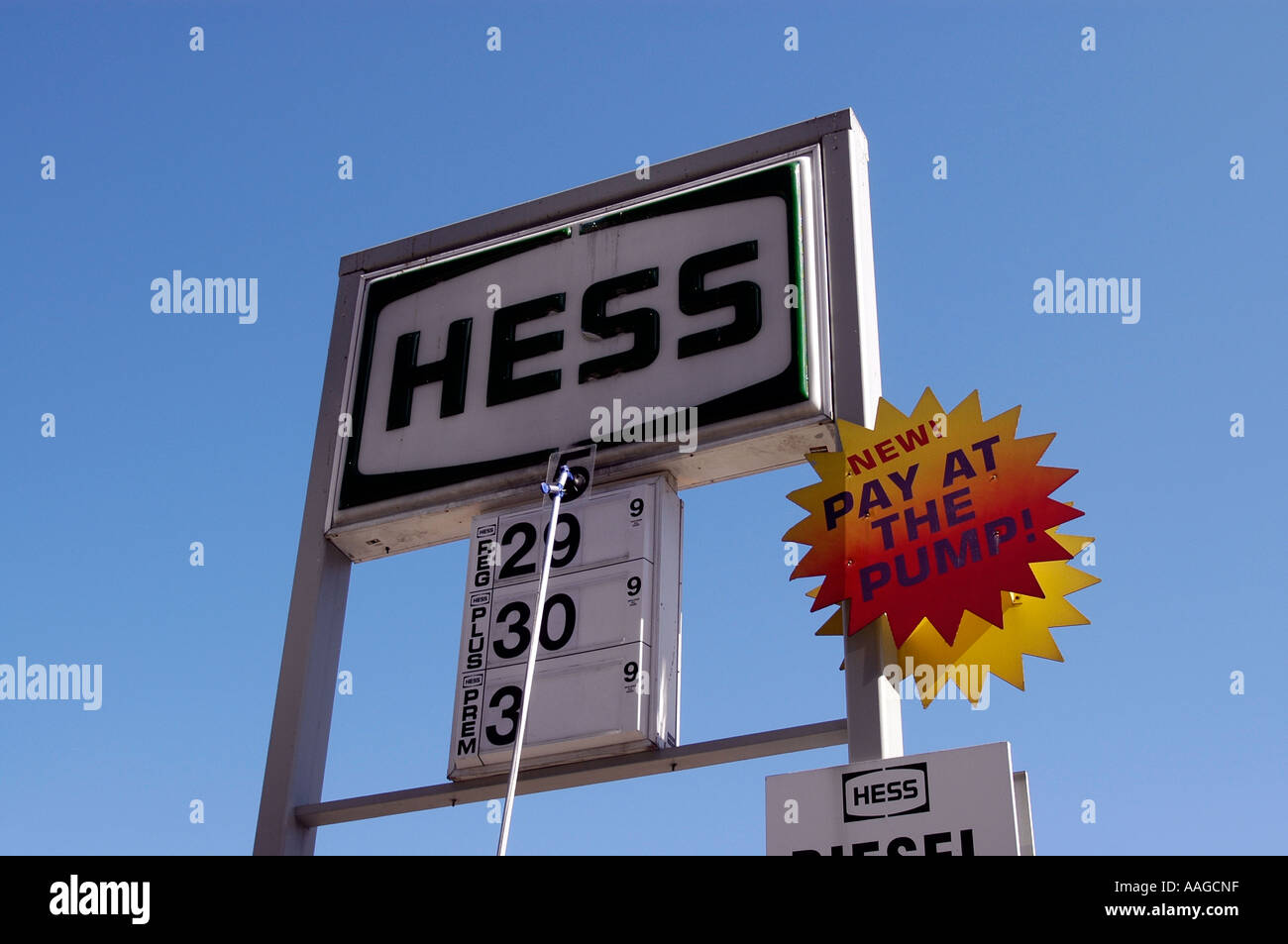 A worker at the Hess gas station in Midtown Manhattan raises the prices ...