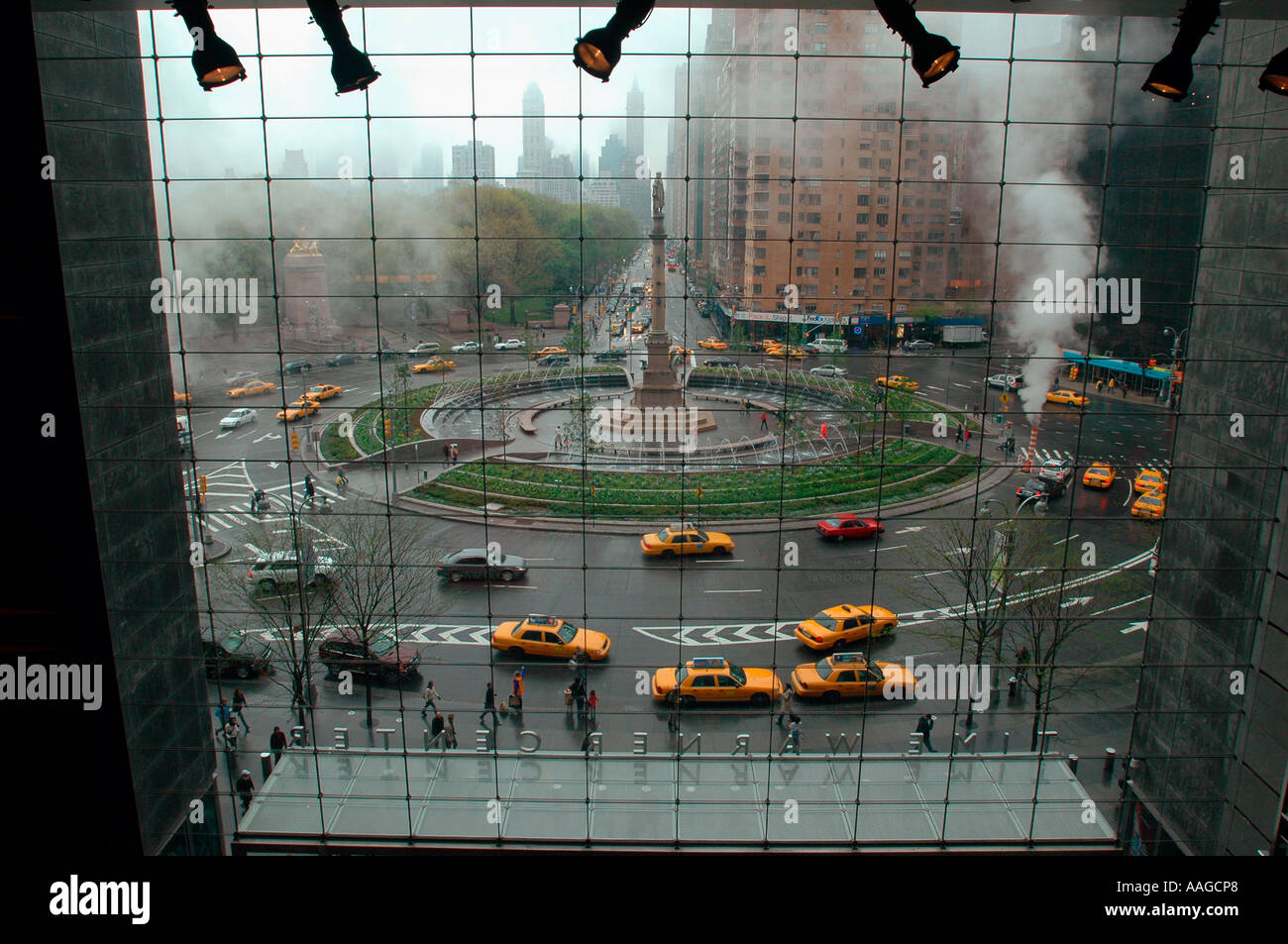 Tourists and New Yorkers enjoy the newly renovated Columbus Circle as ...