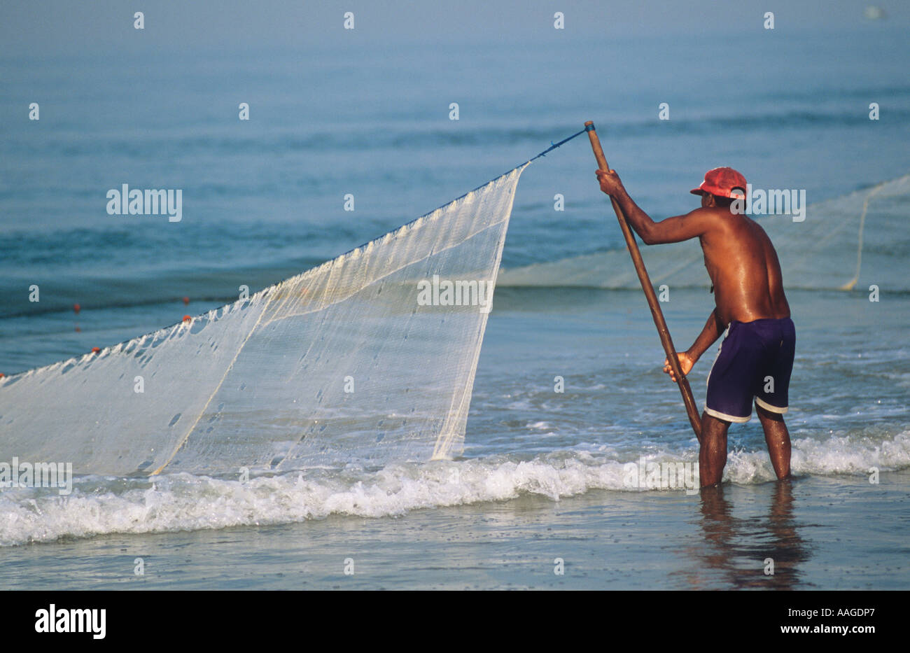 Fisherman and net Colva Beach Goa India Stock Photo - Alamy