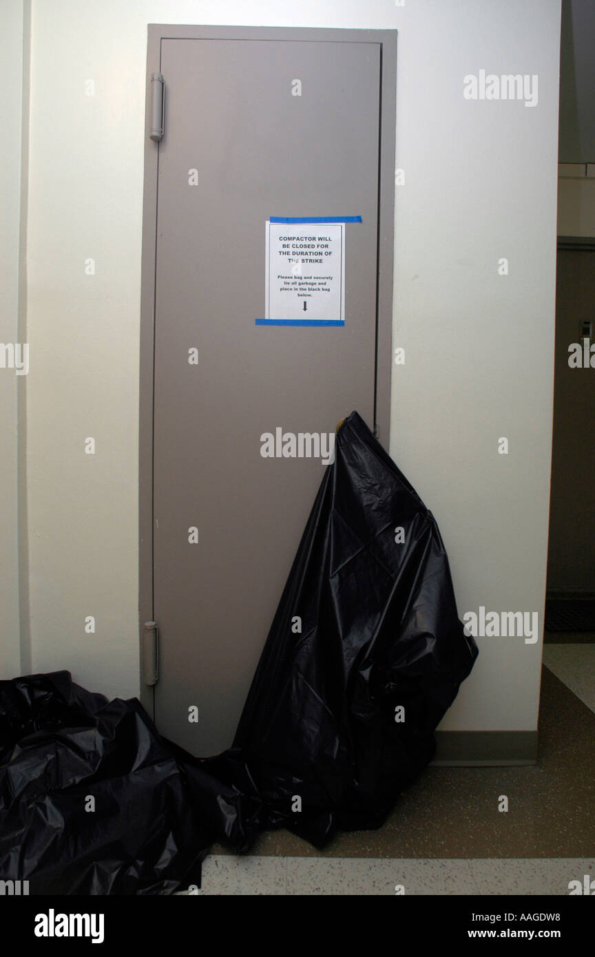 Black plastic garbage bags for the resident s use hang outside the door ...