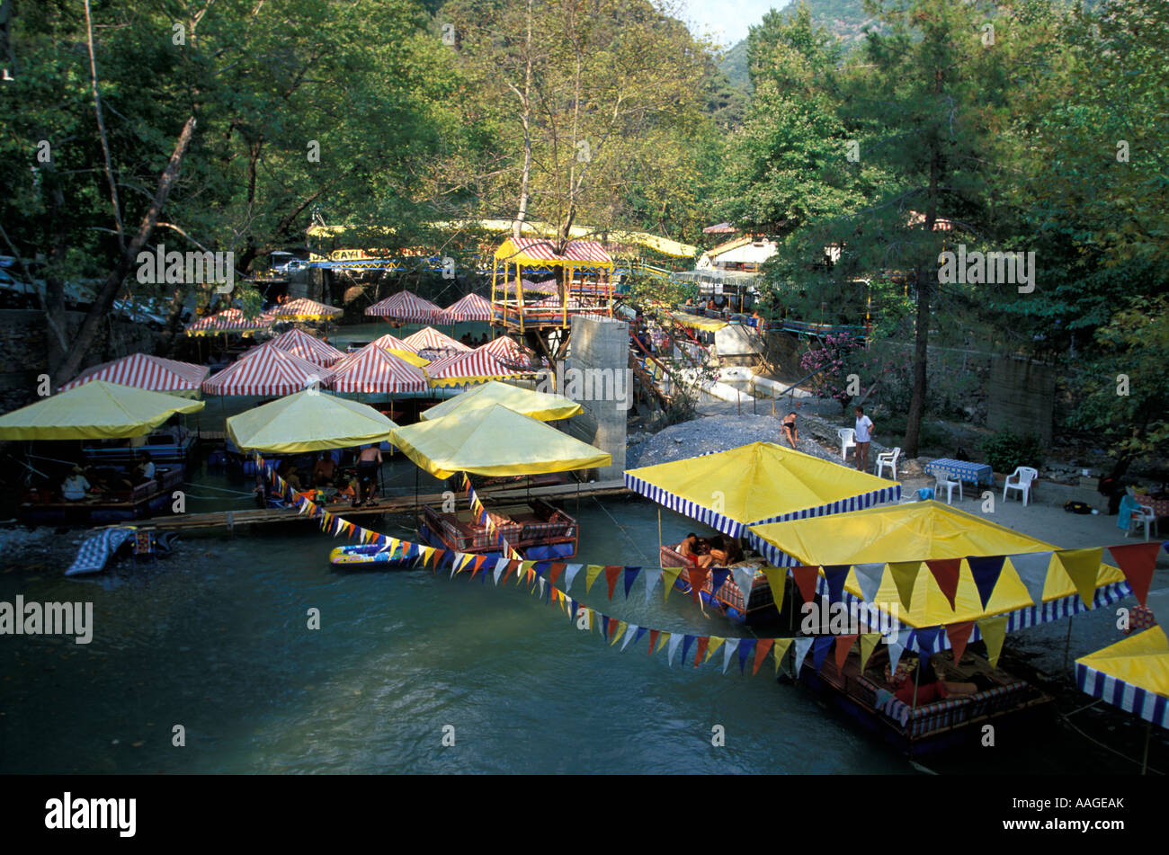 People sitting in Pikinik restaurant over the Dimcayi river near Alanya ...