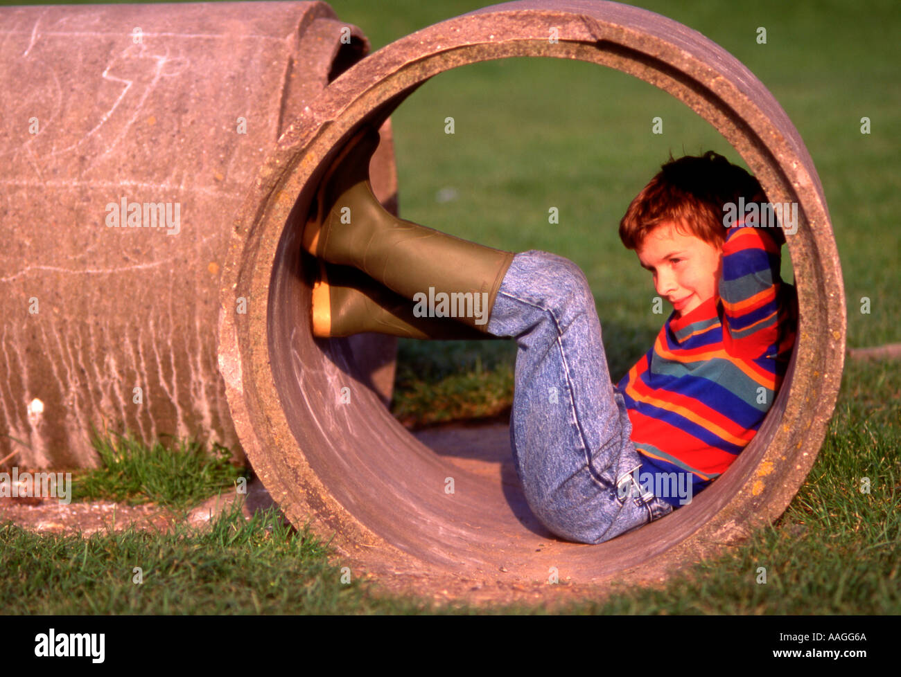 young boy laying in Sun Stock Photo - Alamy