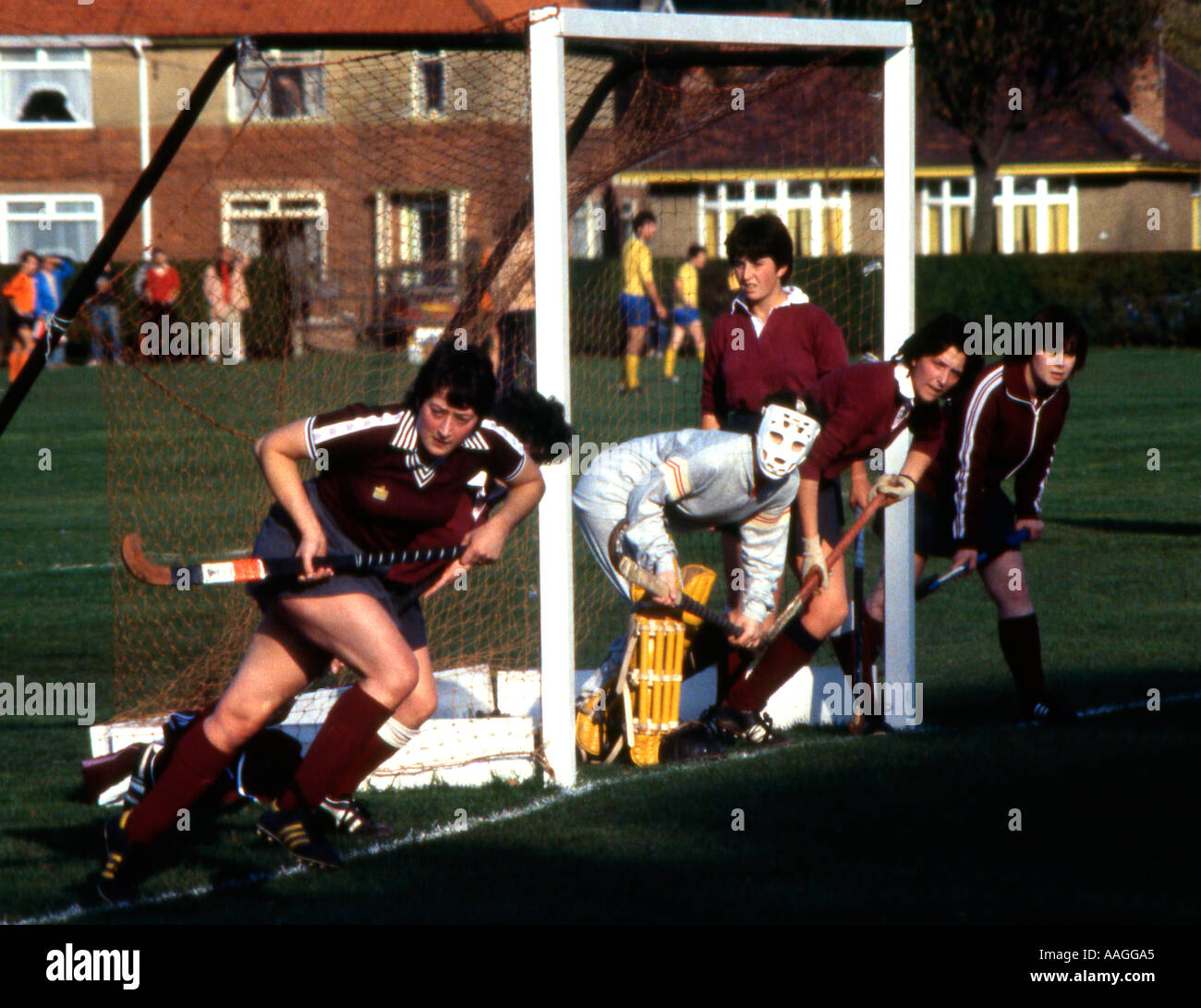 Female hockey players running off goal line Stock Photo - Alamy