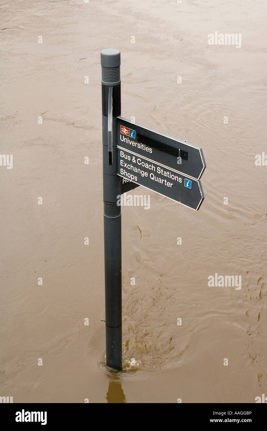 Flooded River Aire submerged footpath sign on tow path at Brewery Wharf ...