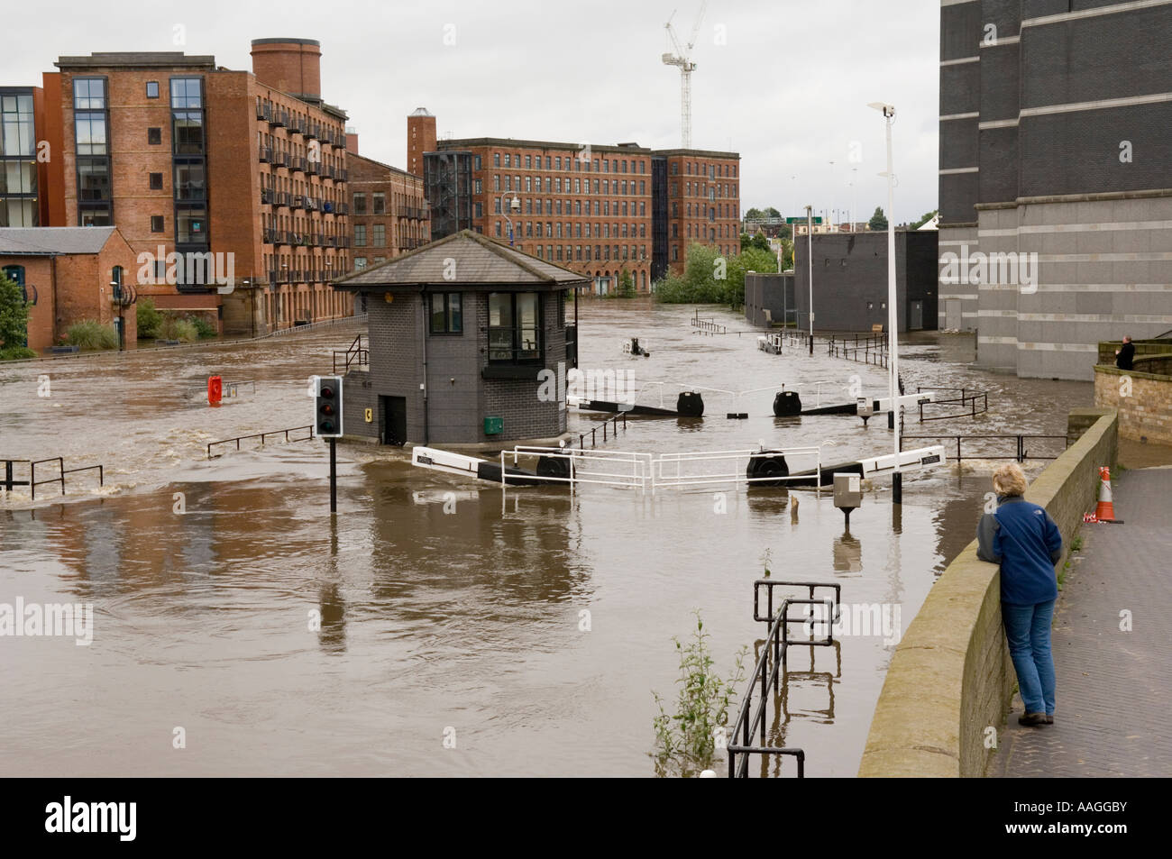 River Aire & Leeds Liverpool Canal had flooded & merged. View of lock ...