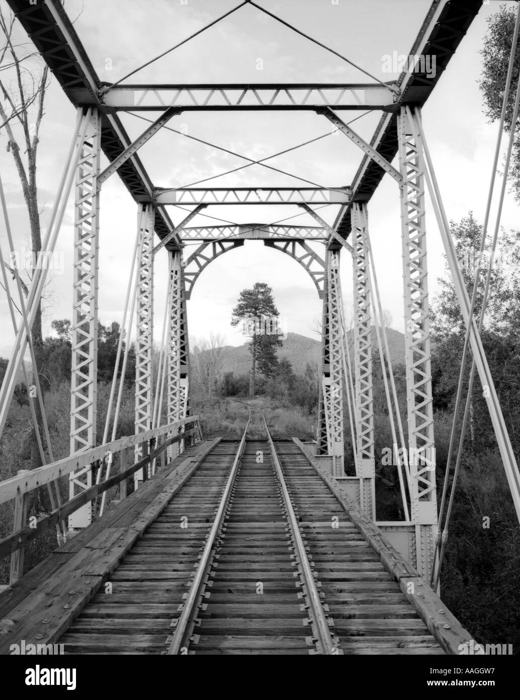 Narrow gage railroad tracks cross a historic bridge in Chama Colorado ...