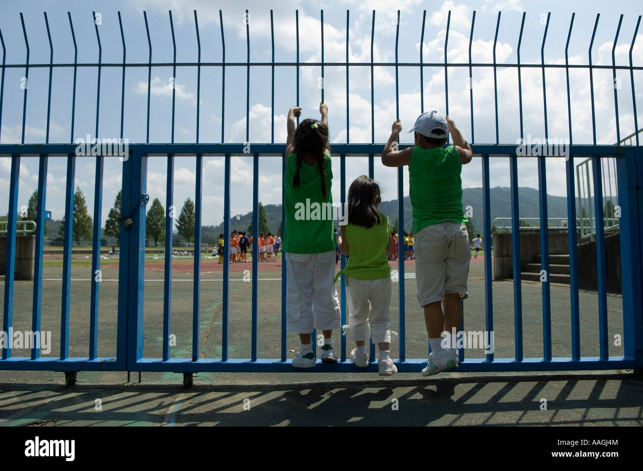Rear view of children standing Stock Photo - Alamy