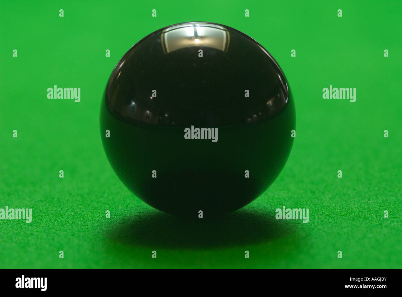 Black ball on the green baize of a snooker table UK Stock Photo - Alamy