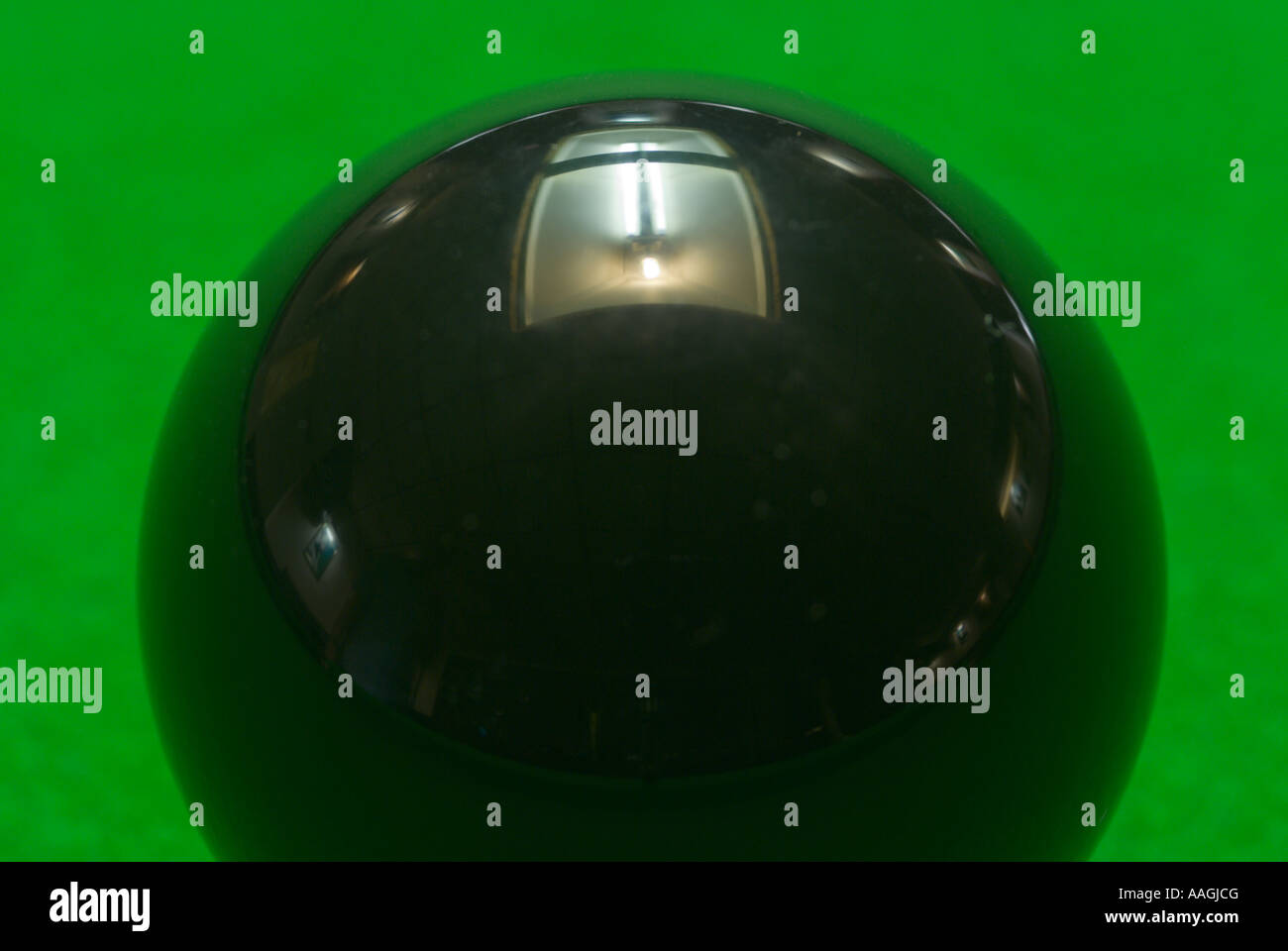 Black ball on the green baize of a snooker table UK Stock Photo - Alamy