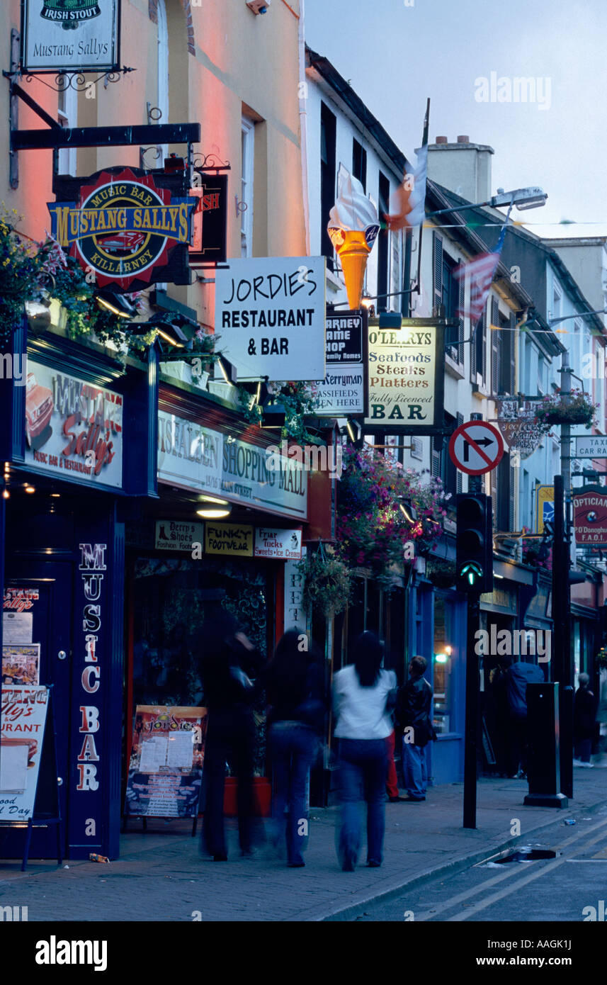 Street scene with three girls and restaurant signs on mainstreet ...