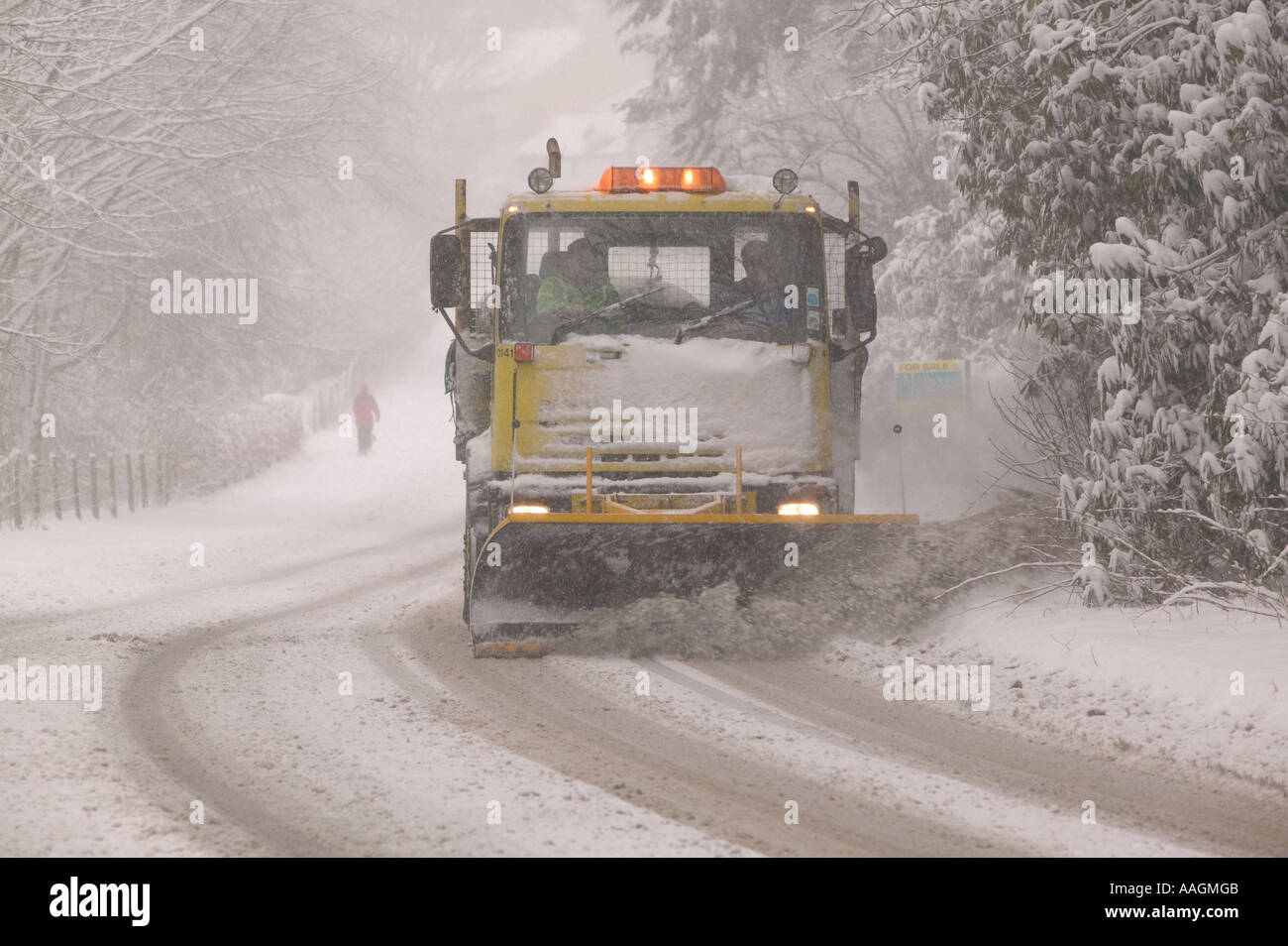 a snow plough clearing the roads in Ambleside during heavy winter snow ...