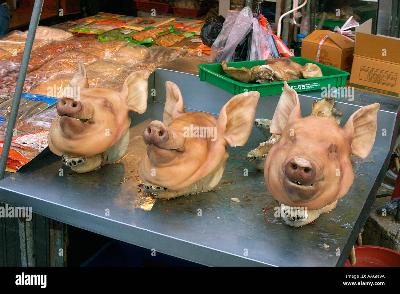 Pig heads on display at Jagalshi fish market Busan South Korea Stock ...