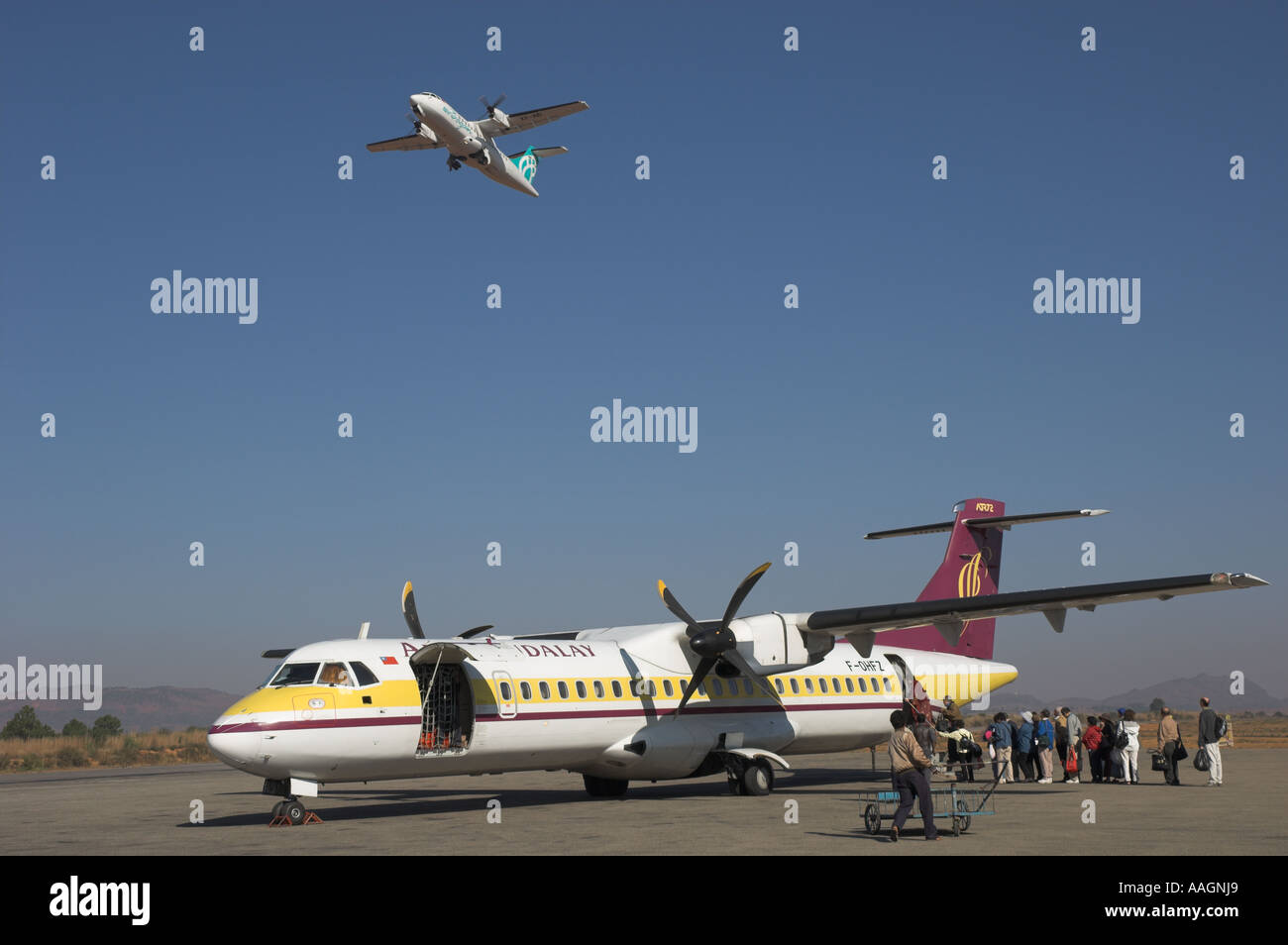 Myanmar Burma Local airline propeller aircraft travellers boarding a ...