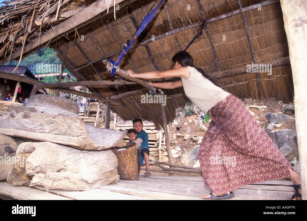 Women grinding corn hi-res stock photography and images - Alamy