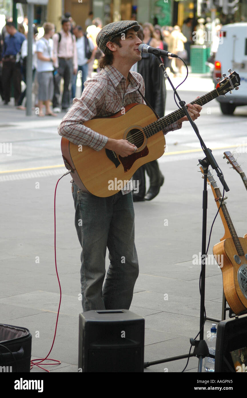 Busker street musician singer guitar player hi-res stock photography ...