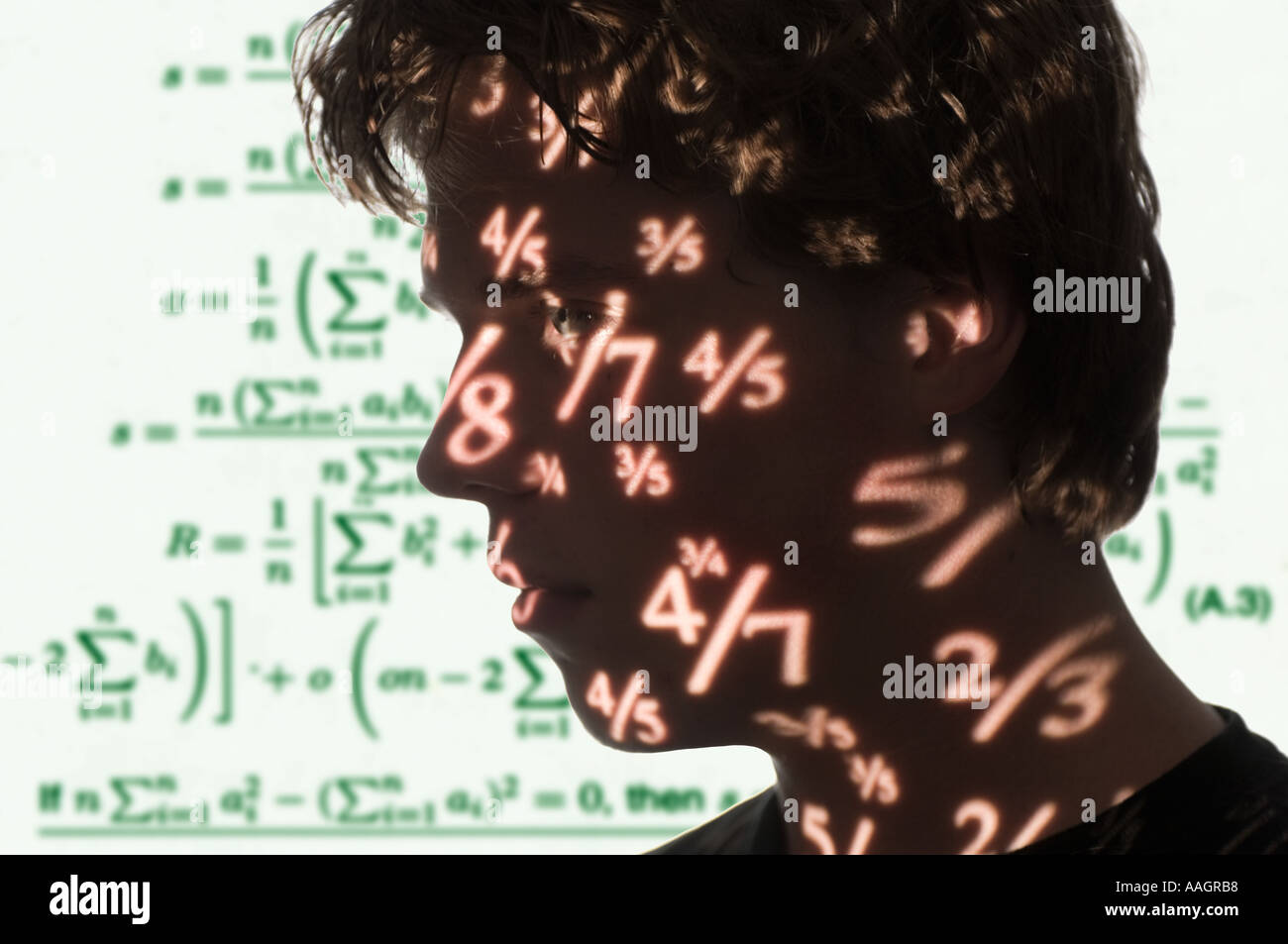 teen age boy working on computer with symbols and fraction images composited Stock Photo - Alamy