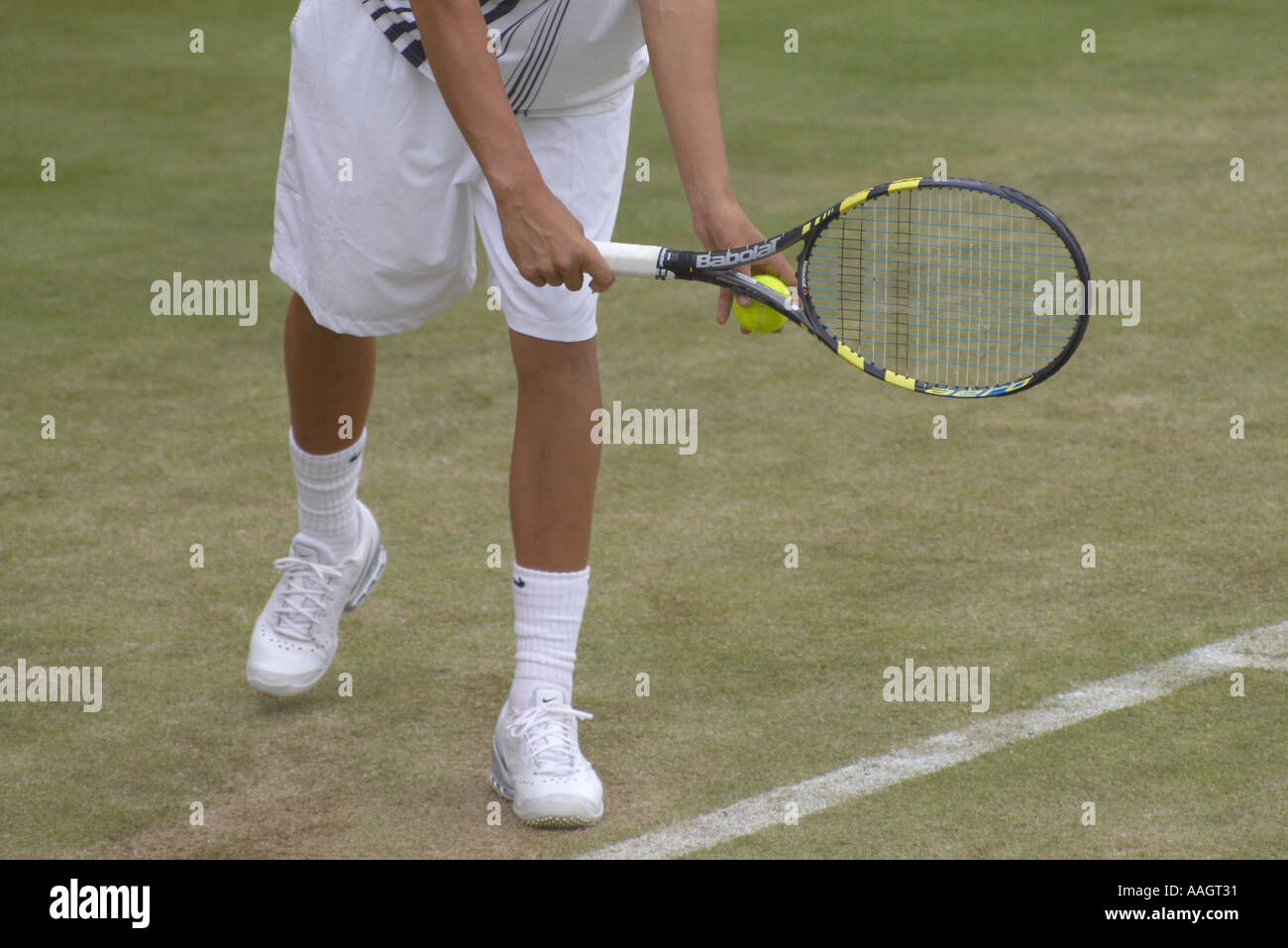 a tennis player prepares to serve Stock Photo - Alamy